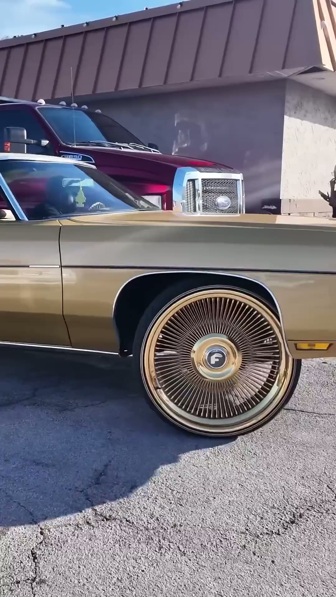 73 Chevy donk on gold 26’s Forgiato wire wheels