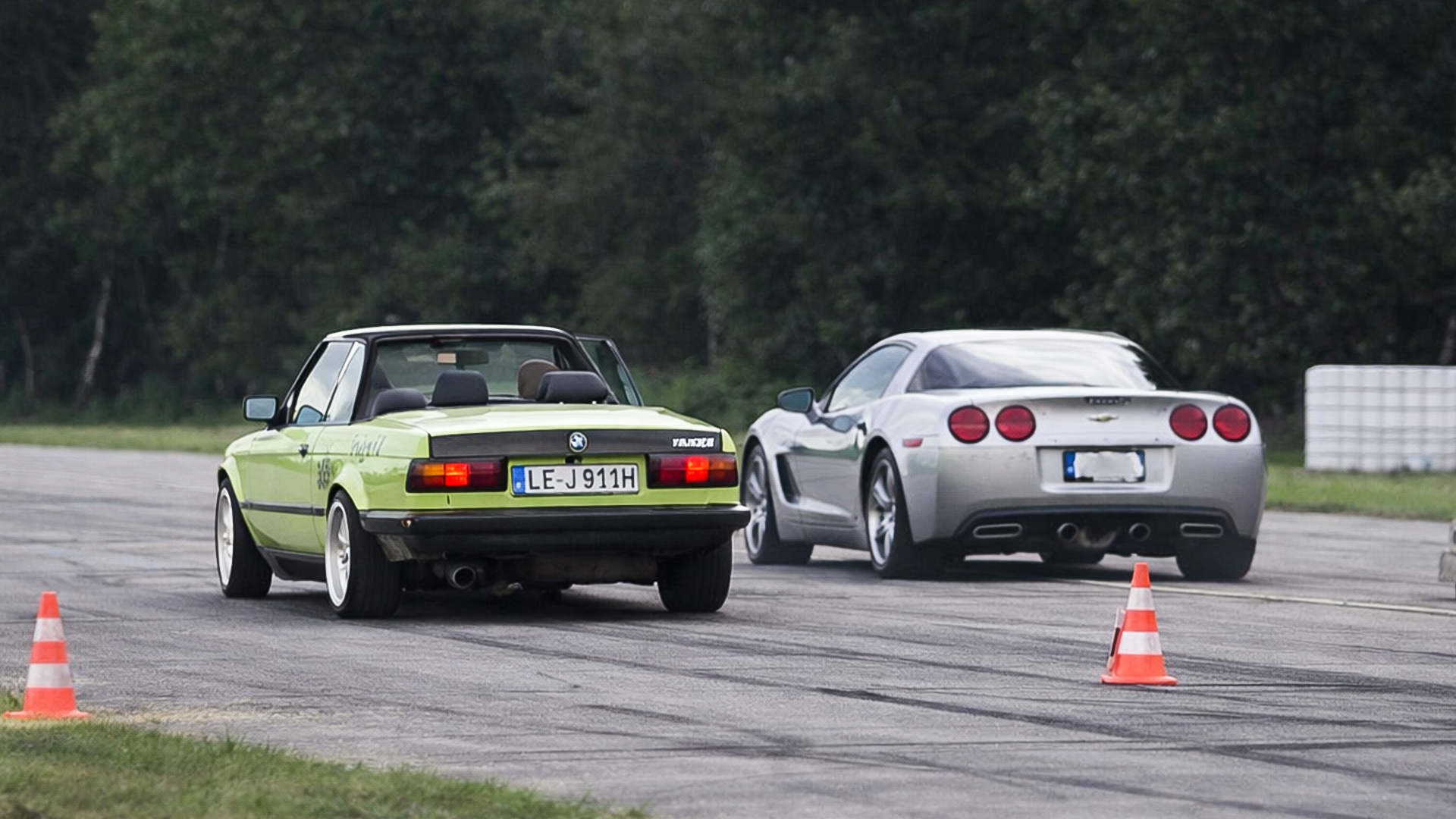 Drag race showdown between Corvette and BMW