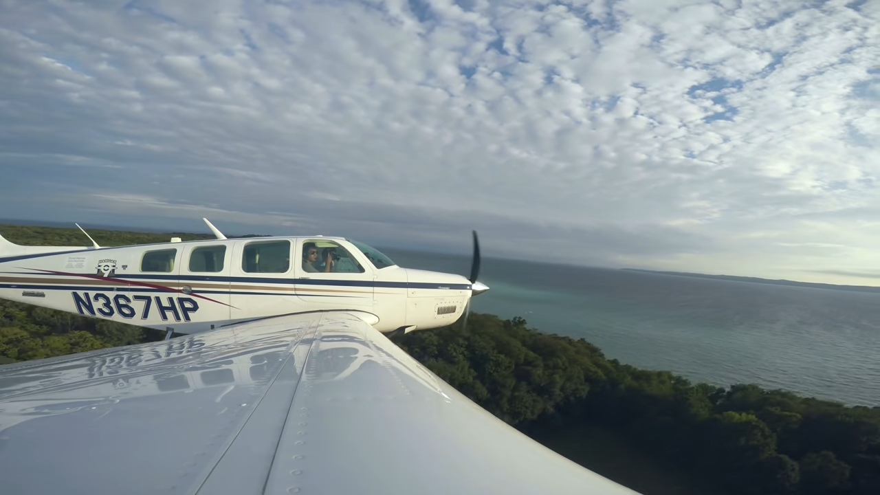 Watch a pilot thread through storms over open water