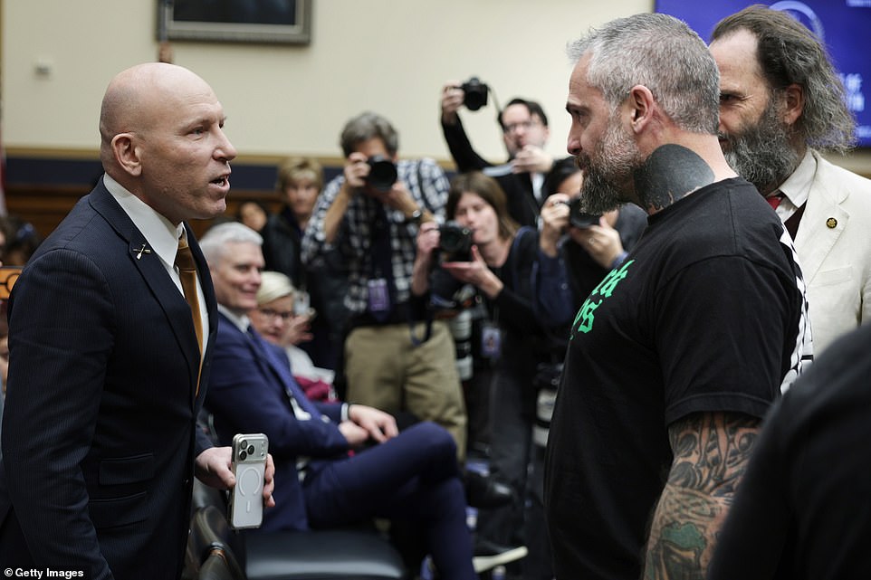Ex-cop who was beaten on Jan. 6 clashes with election denier