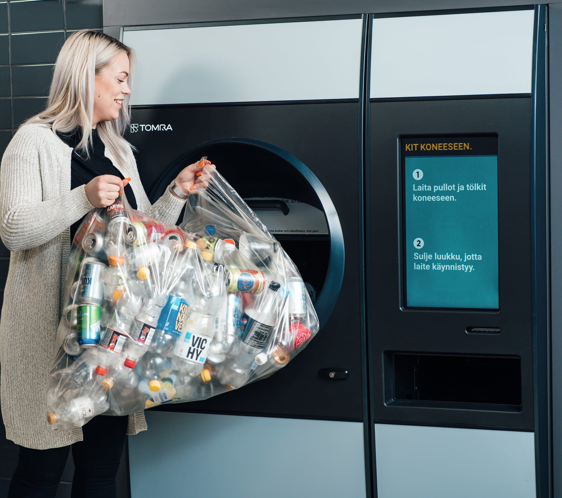 Bottle, can redemption machine allows for dumping whole bag at once