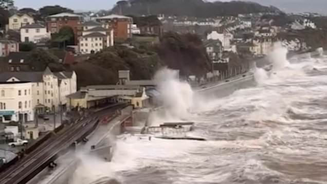 Storm Ingrid throws waves onto railway tracks in Dawlish