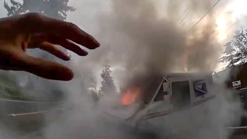Watch Pierce County deputy save driver from burning mail truck