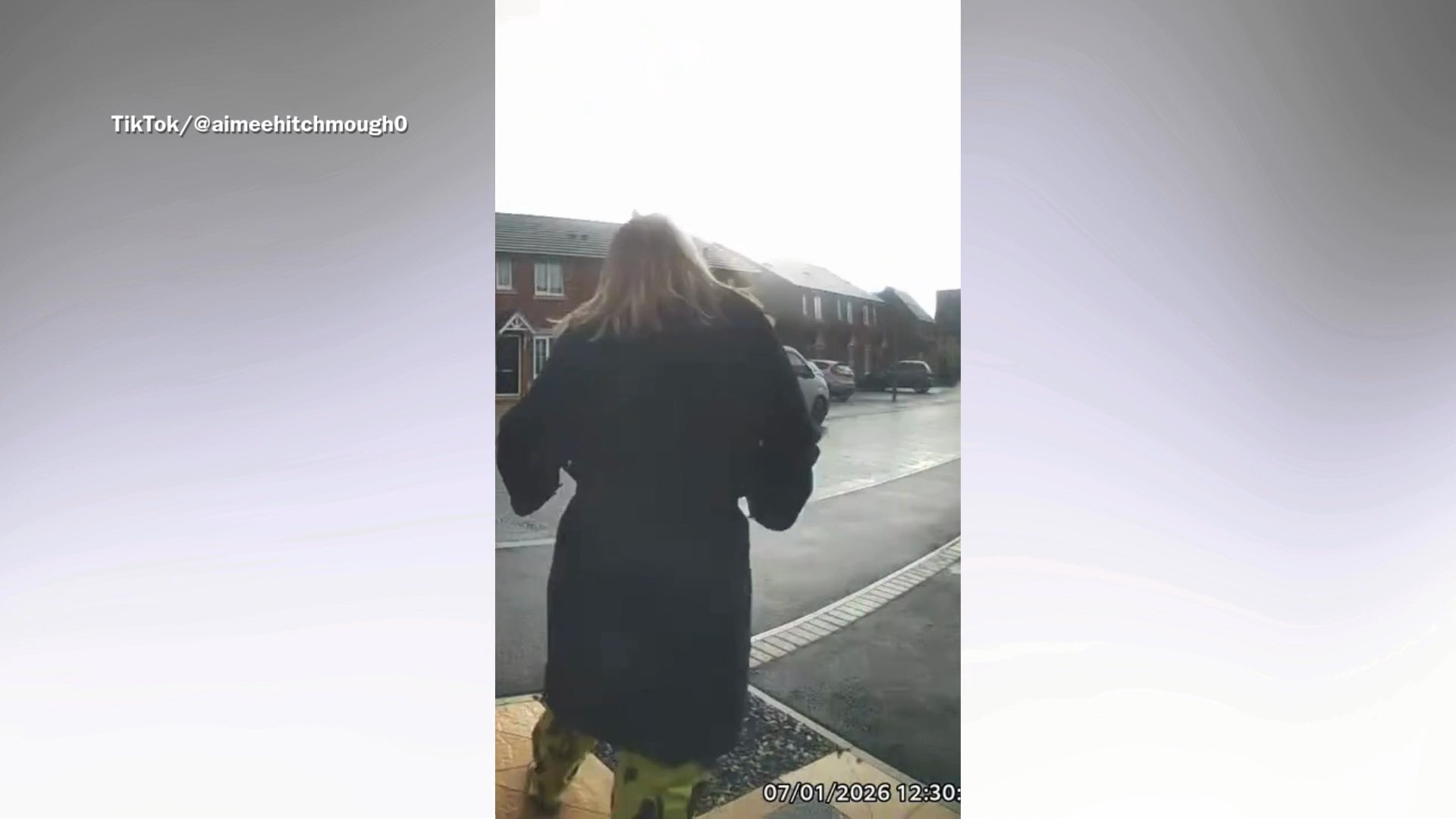 Door cam catches moment woman rescues delivery driver stuck in van