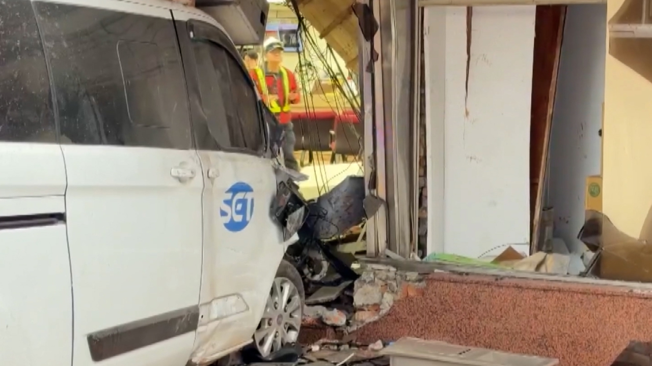 Almost a dozen injured after media van crashes into Taipei bank