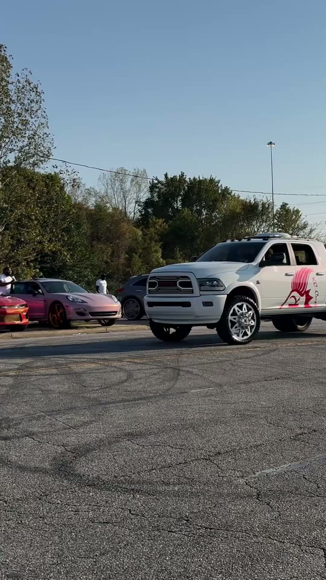KC Customs Pullin up in his White Dodge Dually Truck on 26’s