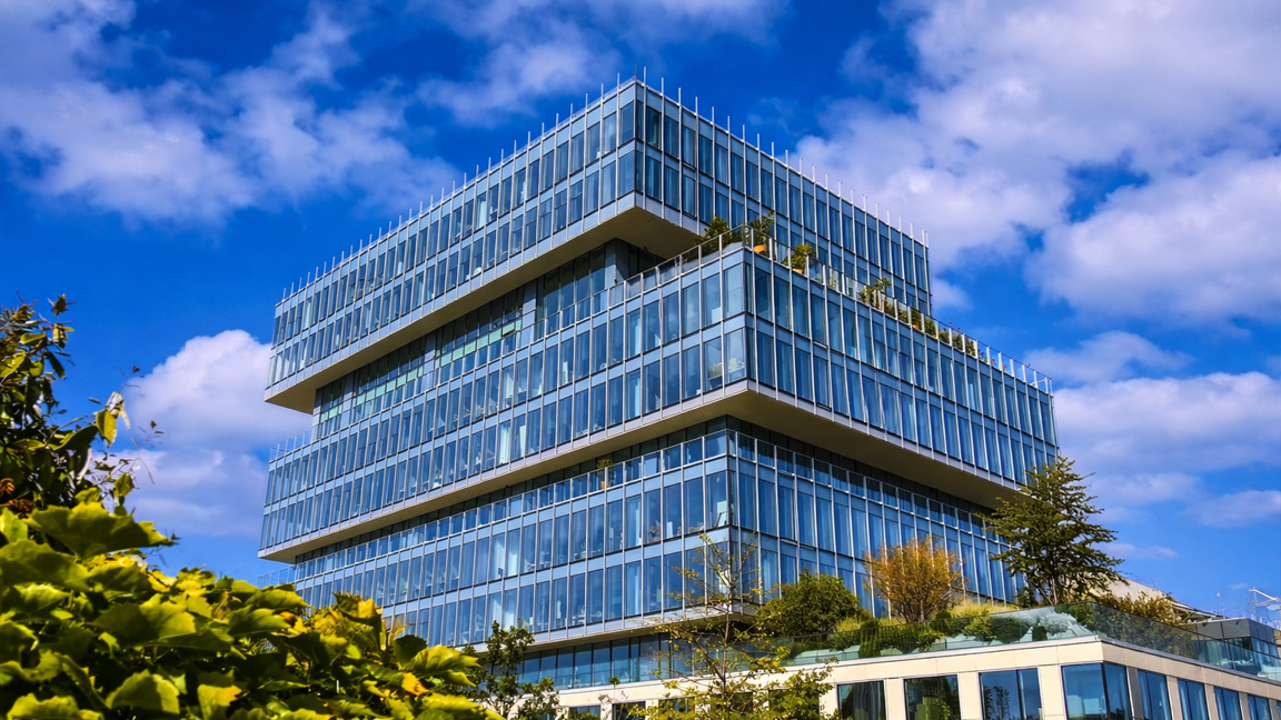 Modern glass building with layered architectural design