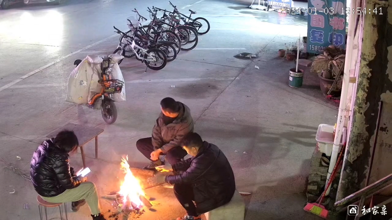 Men startled by fire spark during bonfire in Henan, China