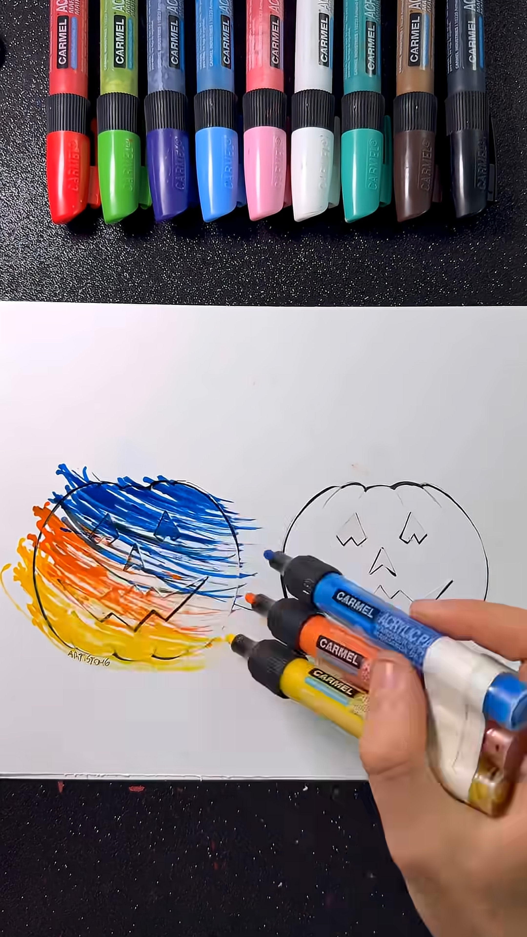 Halloween pumpkins painted with different types of paint markers