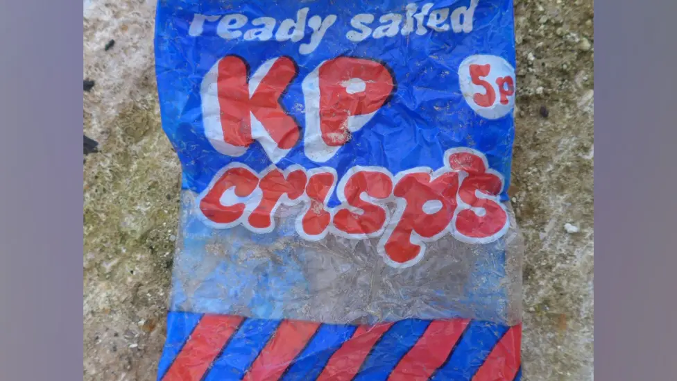 1970s crisp packet and post-war rubbish emerge as Dorset cliffs erode