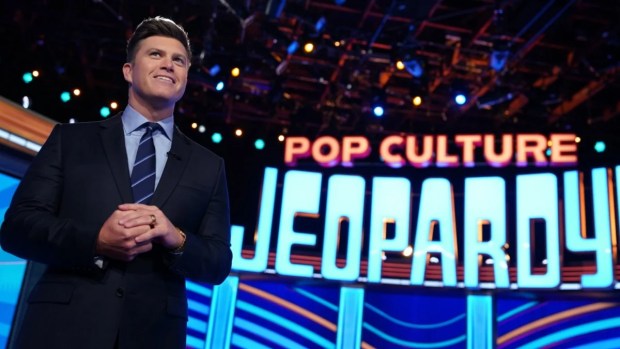 Colin Jost will return to host 'Pop Culture Jeopardy' after its move to ...
