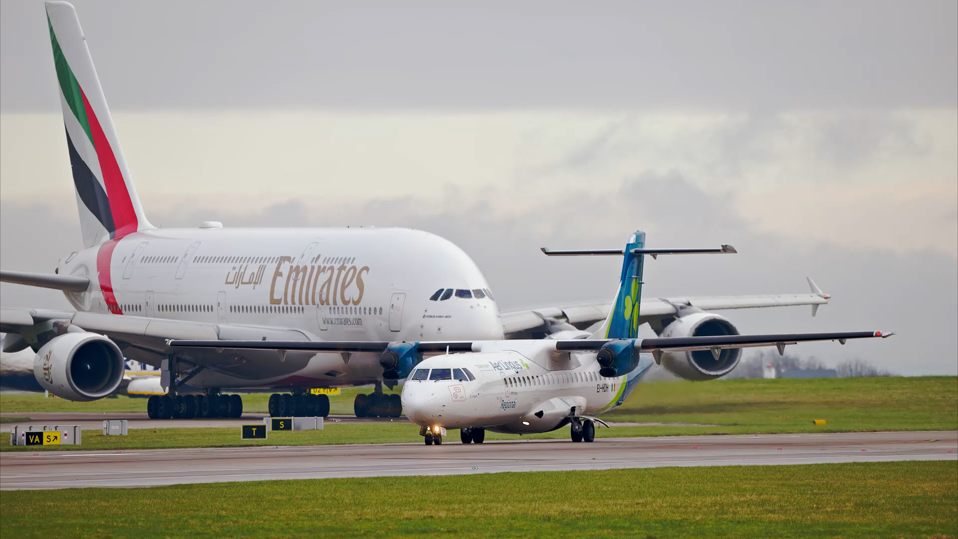 Busy runway scene at Manchester Airport