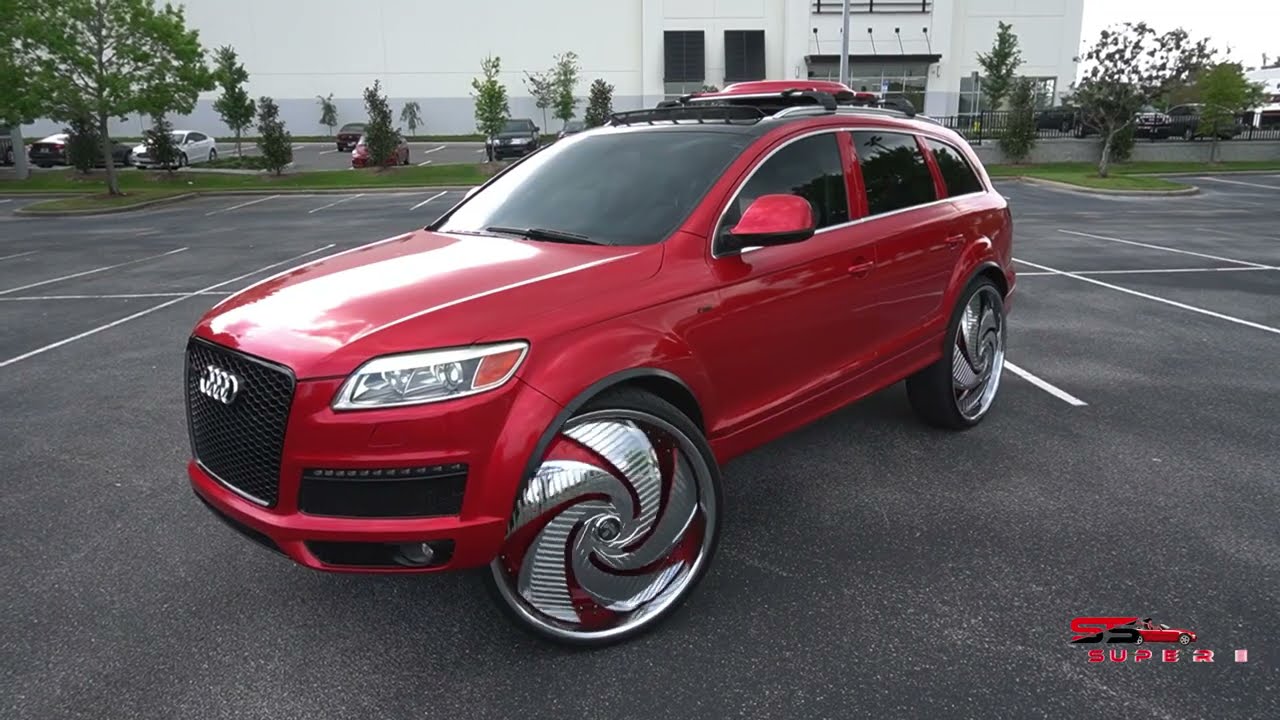 Candy red wrap on Audi Q7 RS on 30” Dub Floaters/ Superior Shelbie