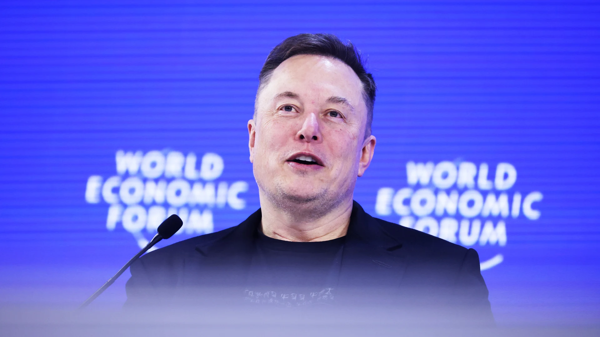 At Davos, Elon Musk says that the future will involve ‘more robots than ...