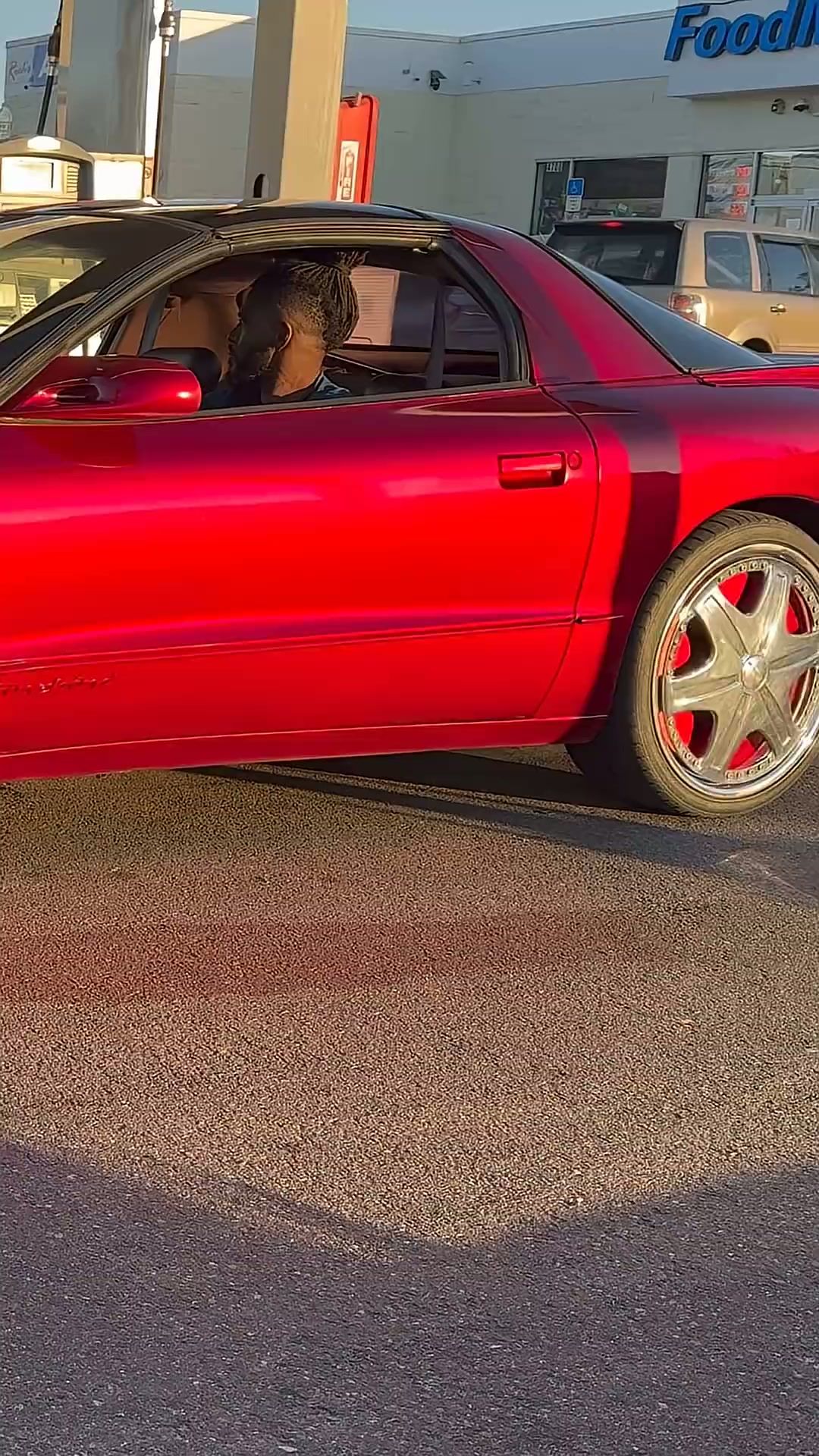Candy red Pontiac Firebird on 20” DUB floaters