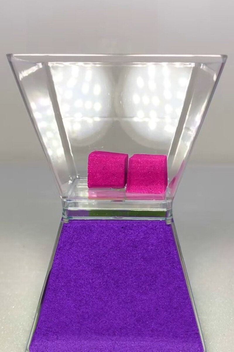 Pink sand cubes on purple base