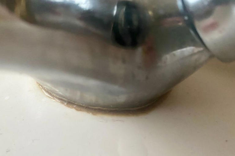 Brown limescale stains on my tap wiped off without scrubbing after ...