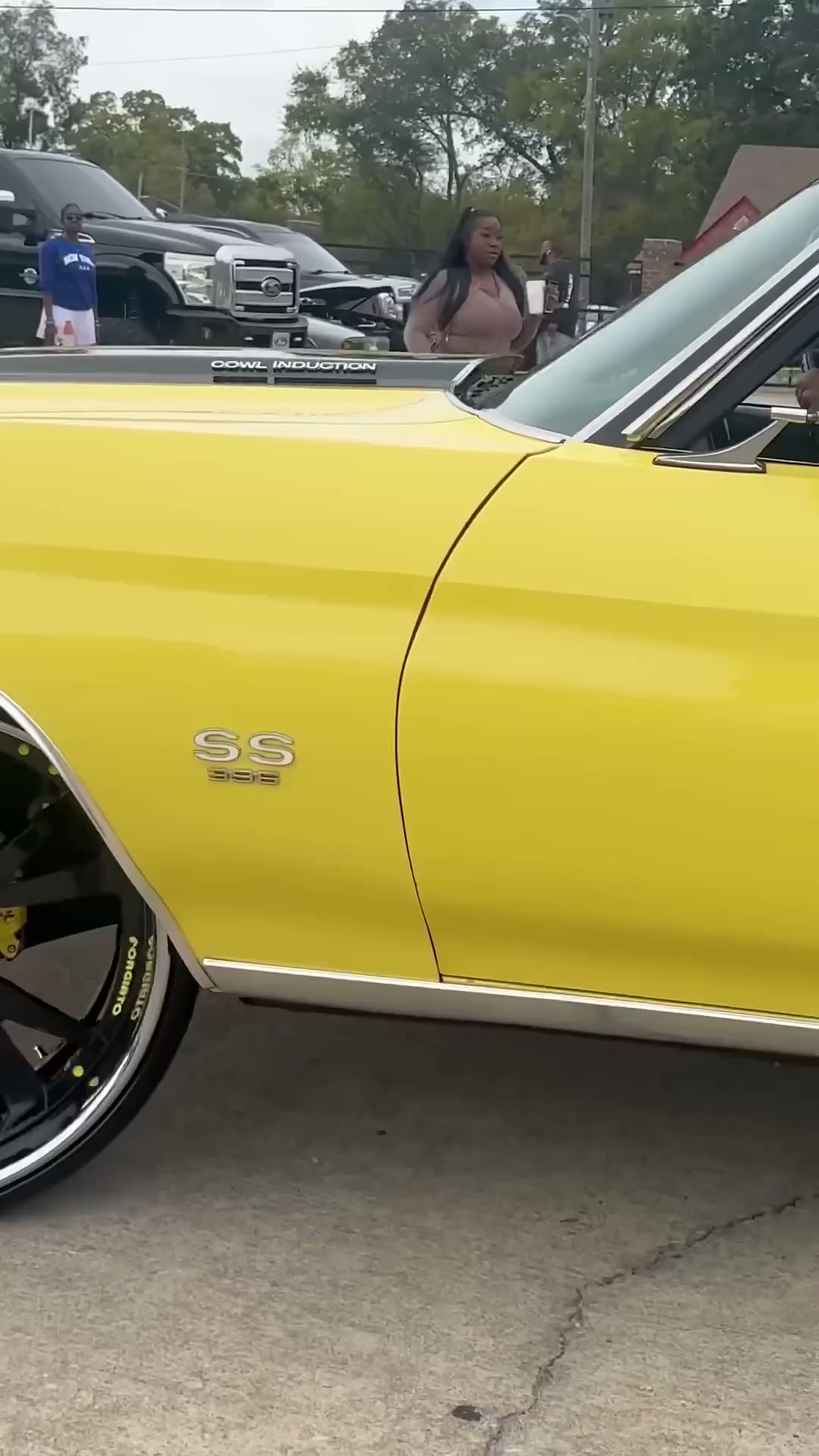 Her yellow Chevy Chevelle SS on 24’s Forgiatos