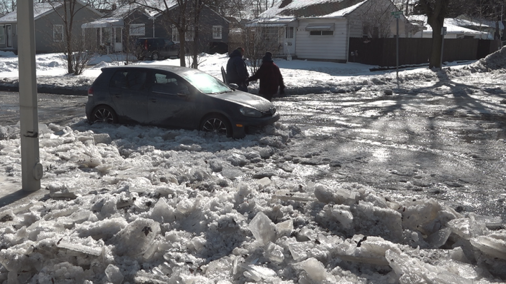 Water main break floods Melvindale streets, strands vehicles