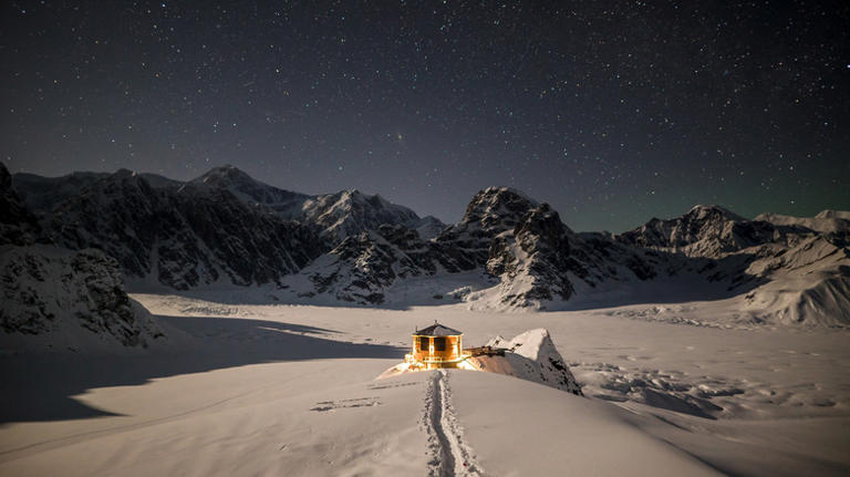 This remote Alaskan chalet sits high above a glacier and is reached ...