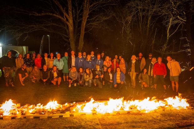 Cancer charity invites people to walk across hot coals and broken glass