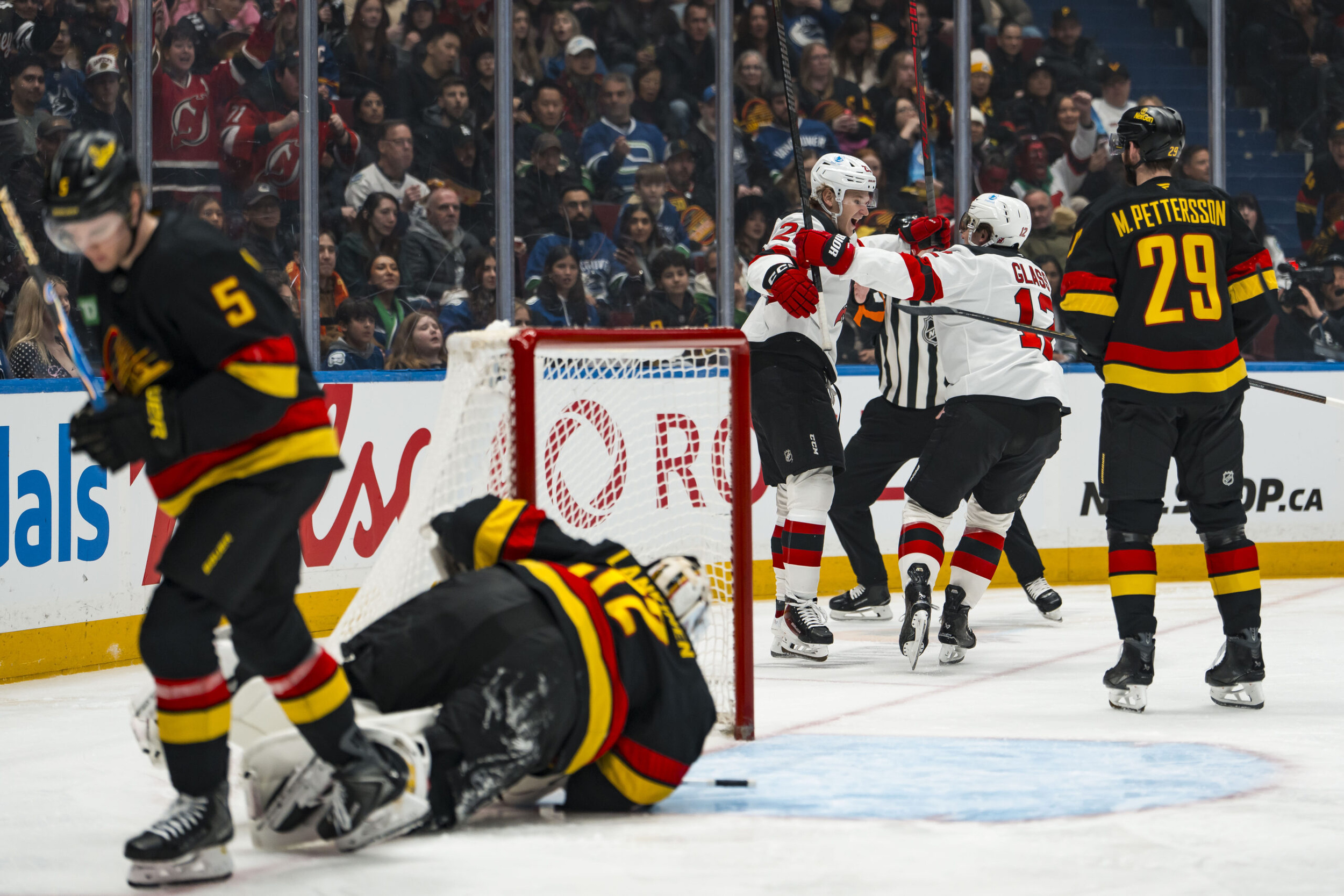 Canucks battle back late but lose 5-4 to Devils