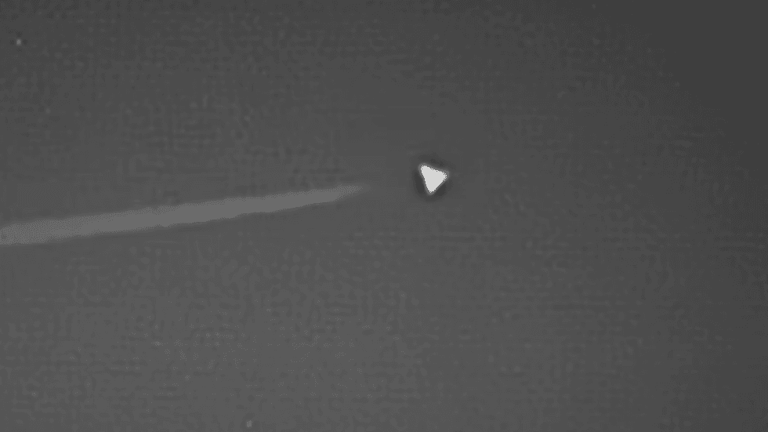 UFO mystery as 'Dorito' shaped craft spotted hovering above top-secret ...