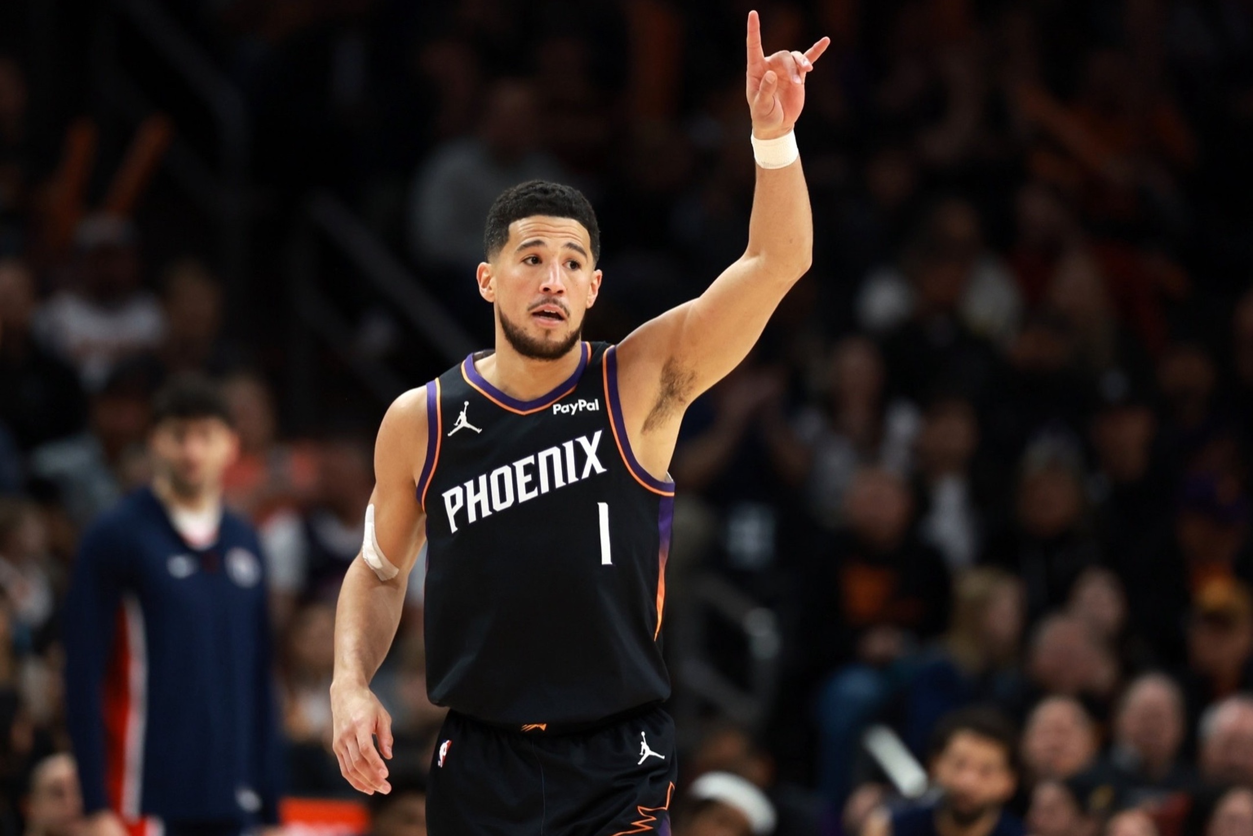 Devin Booker helped to locker room after scary ankle injury