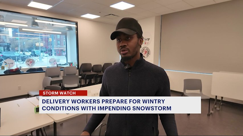 Delivery workers get ready to brave the winter snowstorm