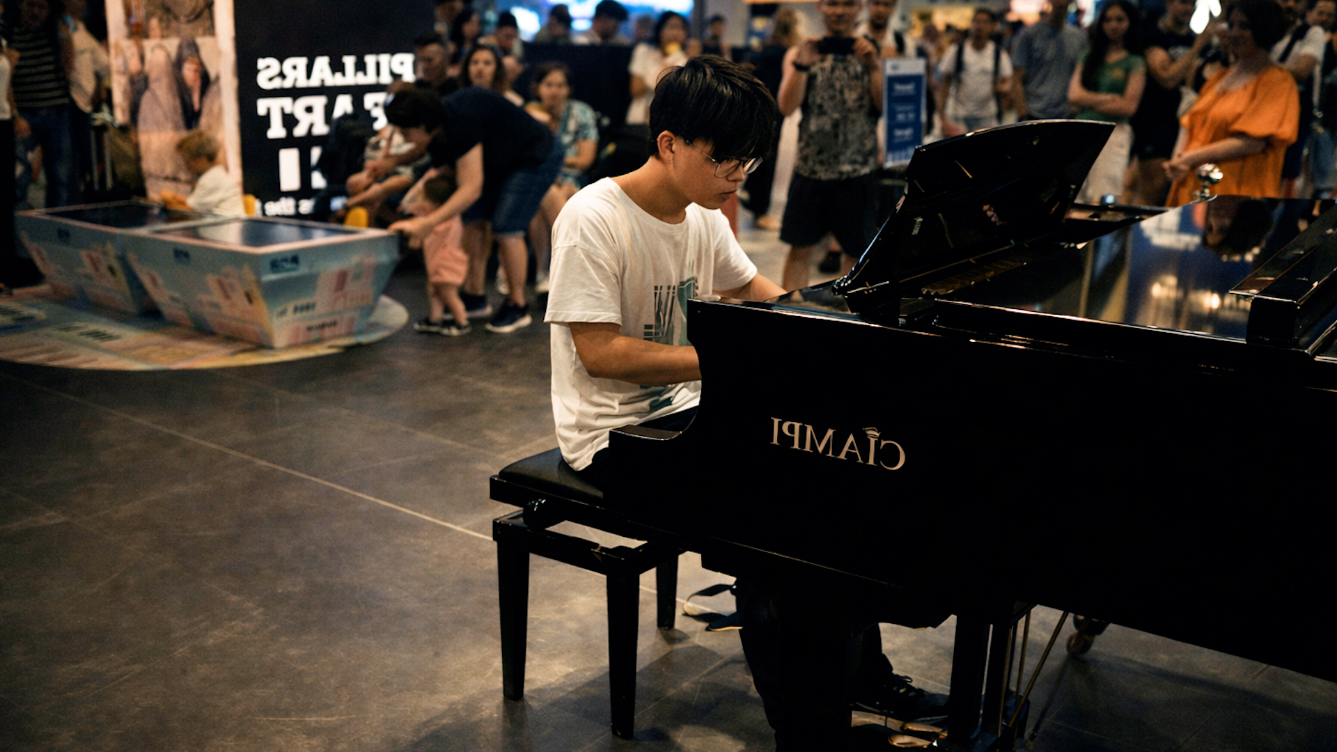 Playing Don’t Stop Me Now on a public airport piano
