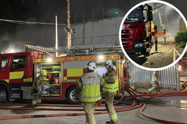 Firefighters cut a person free from overturned car in serious Benfleet ...