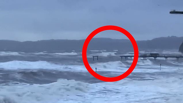 Huge waves rip part of Teignmouth pier away after Storm Ingrid hits