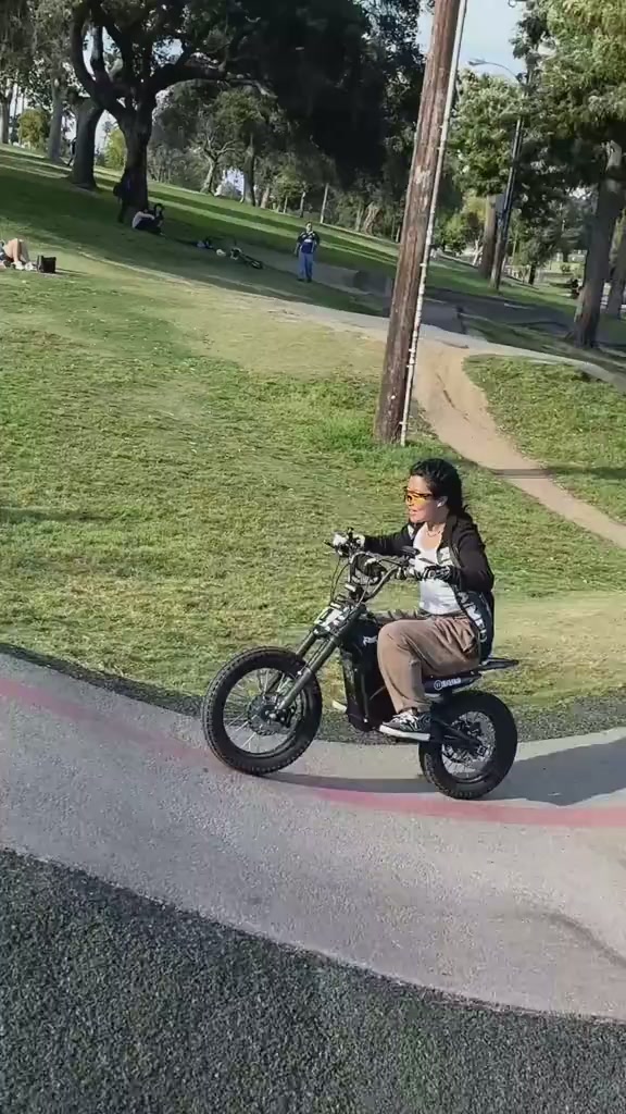 Electric dirt bike and surfskate laps at the pump track