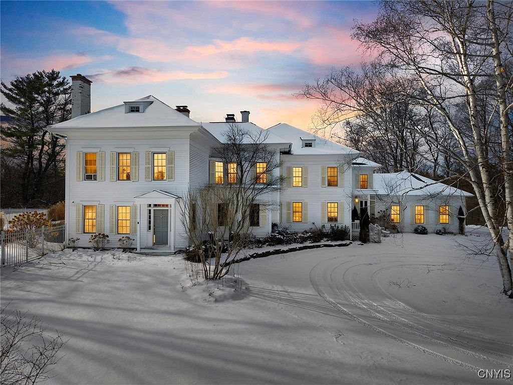 A rare enchanting 1825 estate with modern elegance, 6 fireplaces, & a ...