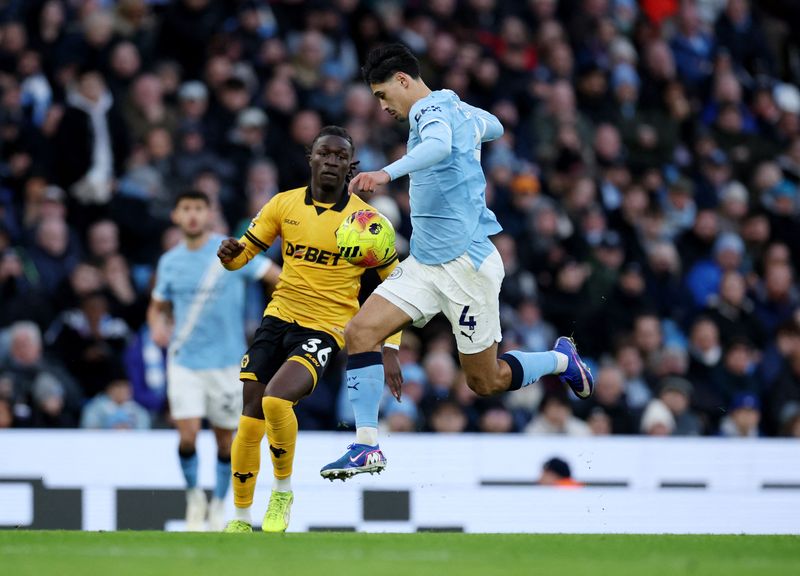 Soccer-Man City back on track with win over Wolves, Liverpool gloom deepens