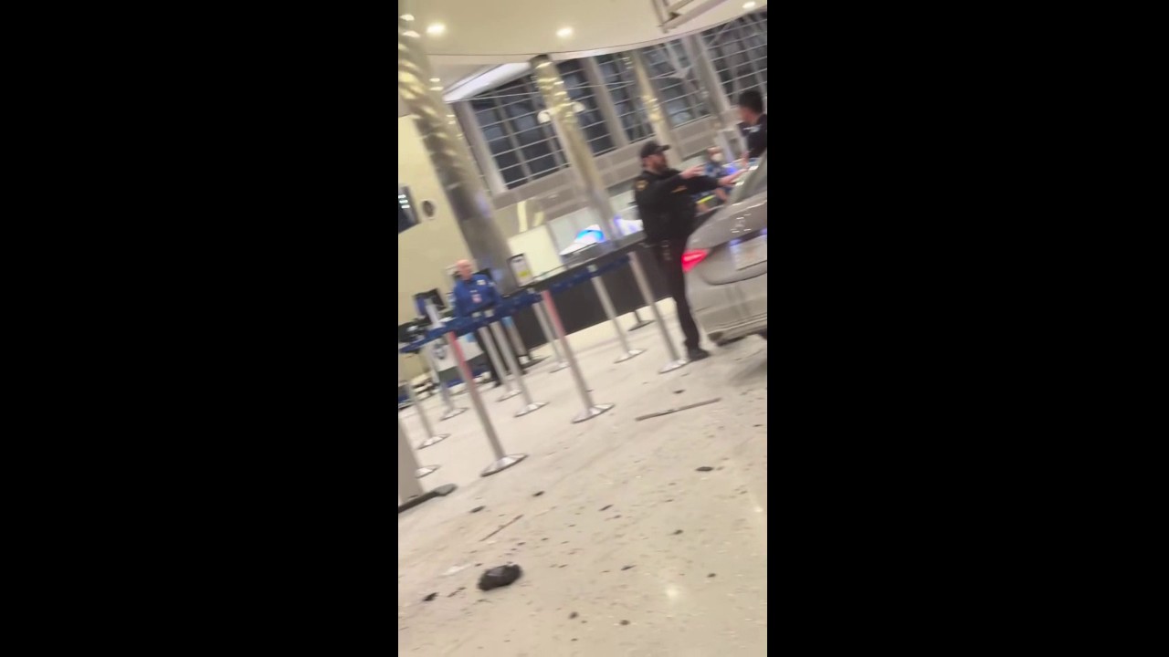 Video from inside Detroit Metro Airport after a driver crashed through ...