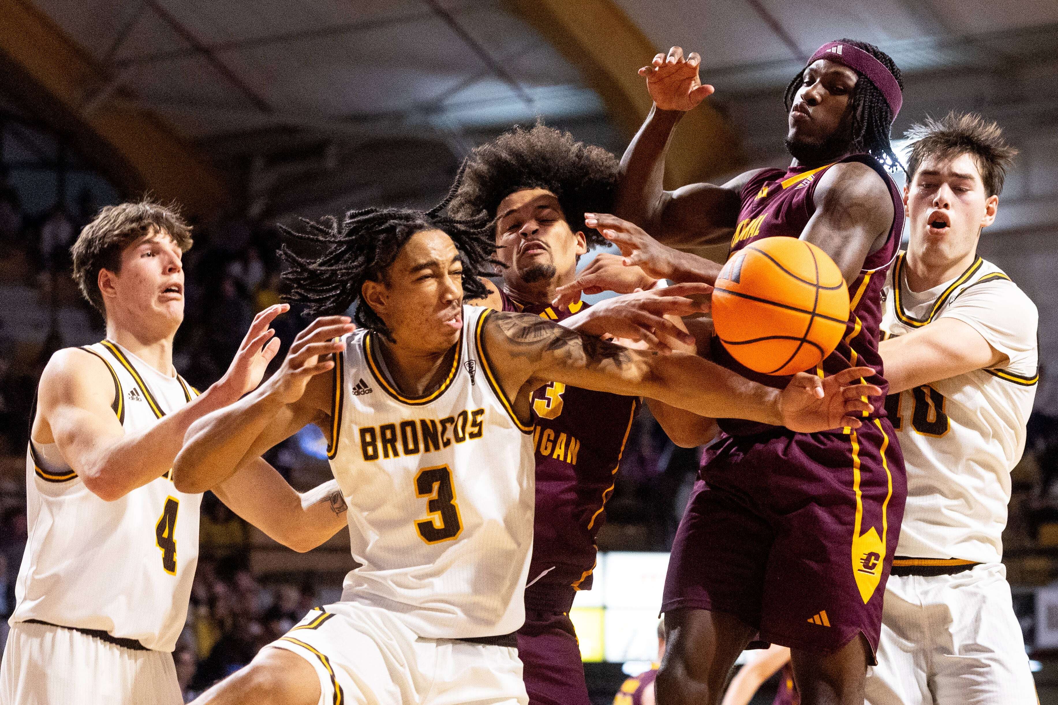 See photos as WMU basketball storms past rival CMU in front of packed ...