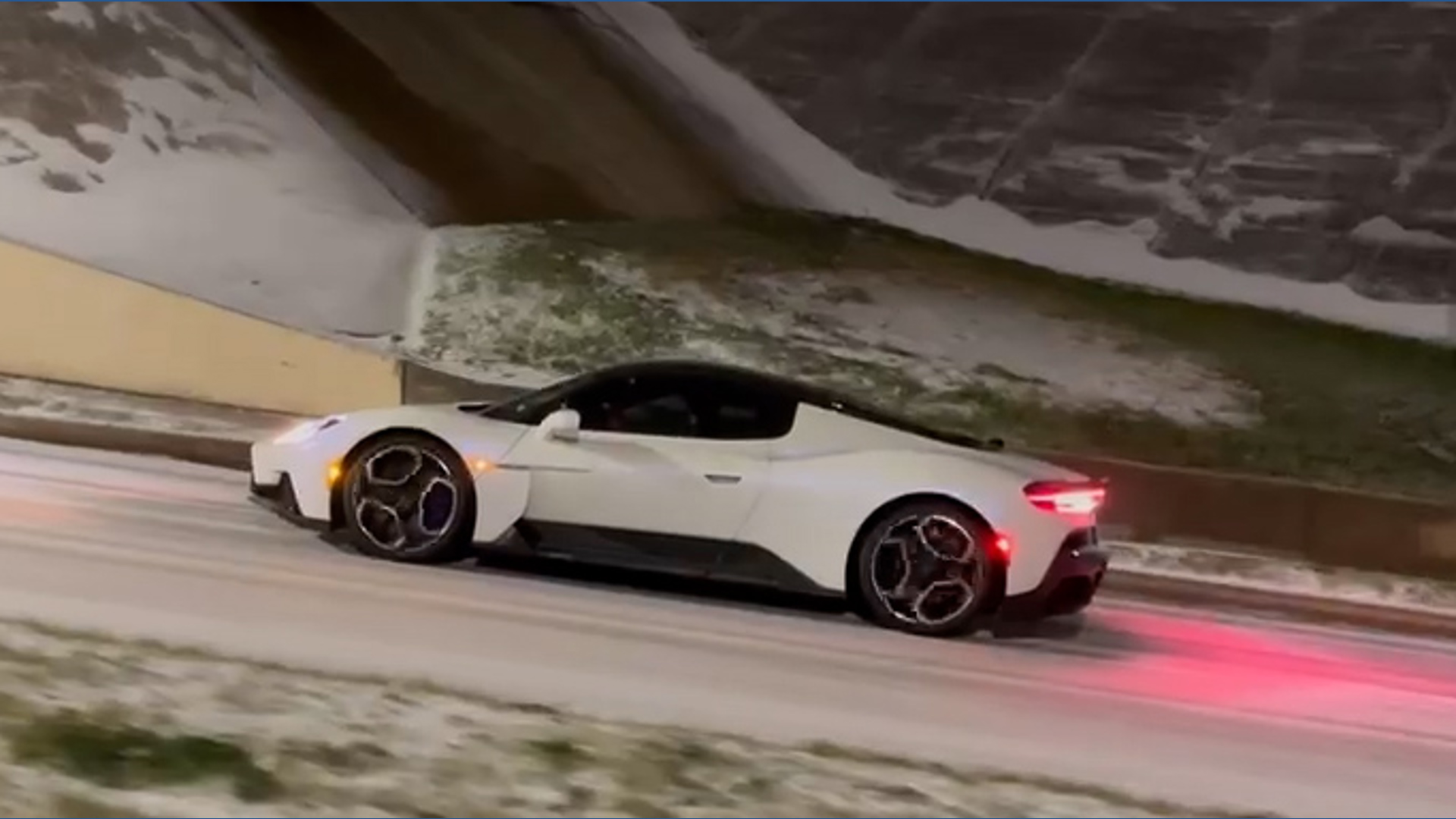 Maserati fails to drive up Harry Hines Boulevard amid icy weather