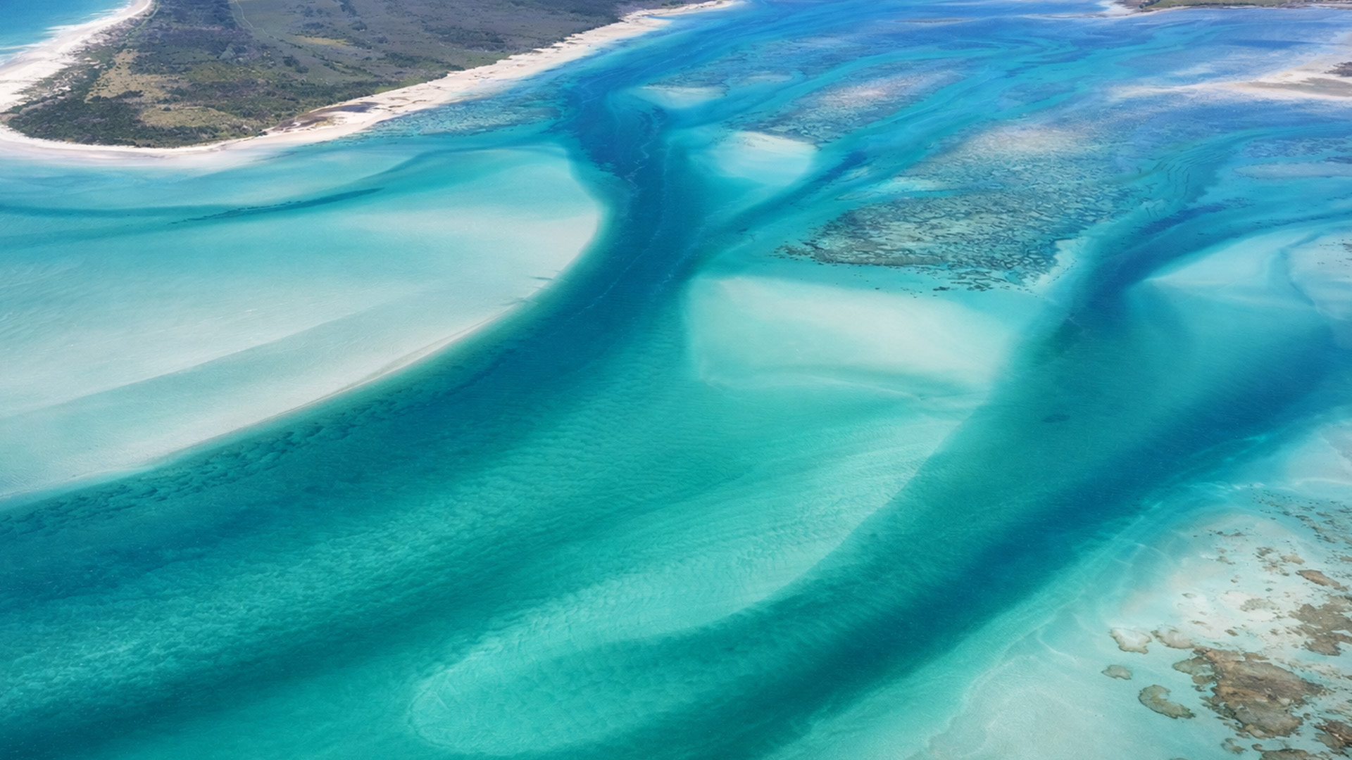 Where the ocean paints the sand