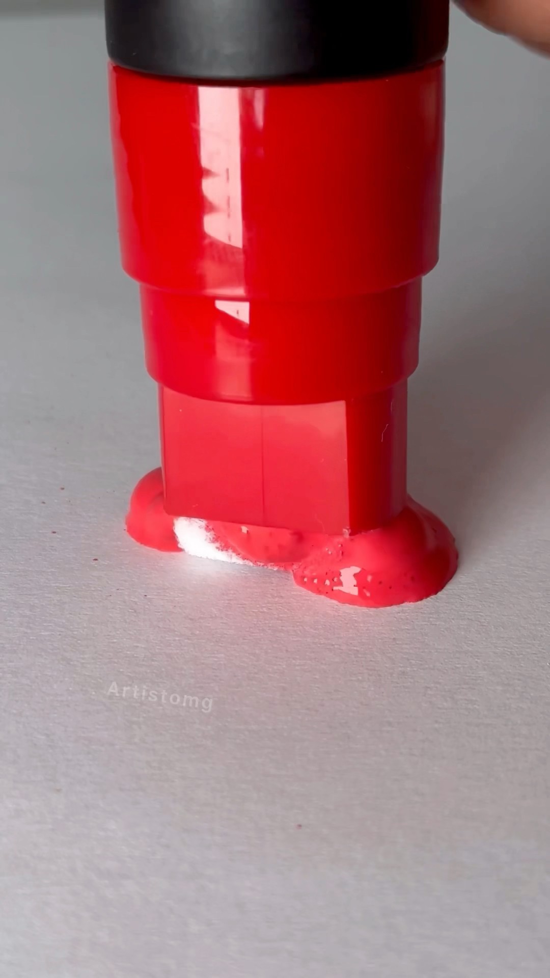 The red paint marker in action