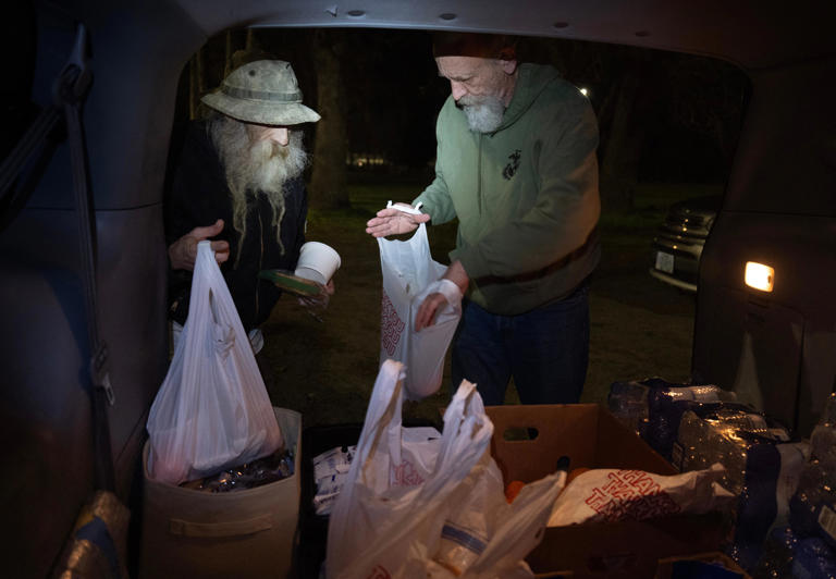'Two old guys in a white van' cook, deliver food to those in need