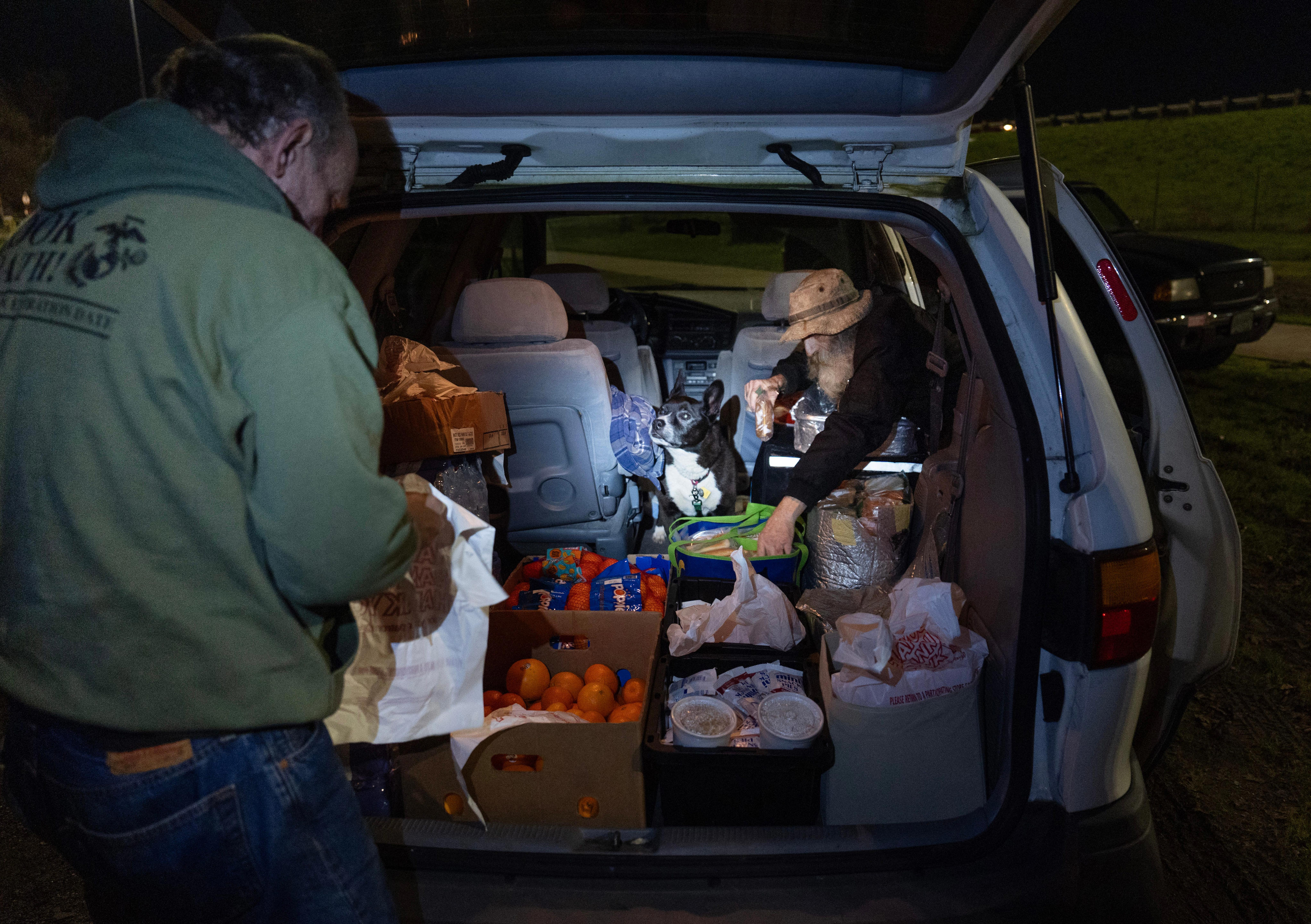 'Two old guys in a white van' cook, deliver food to those in need