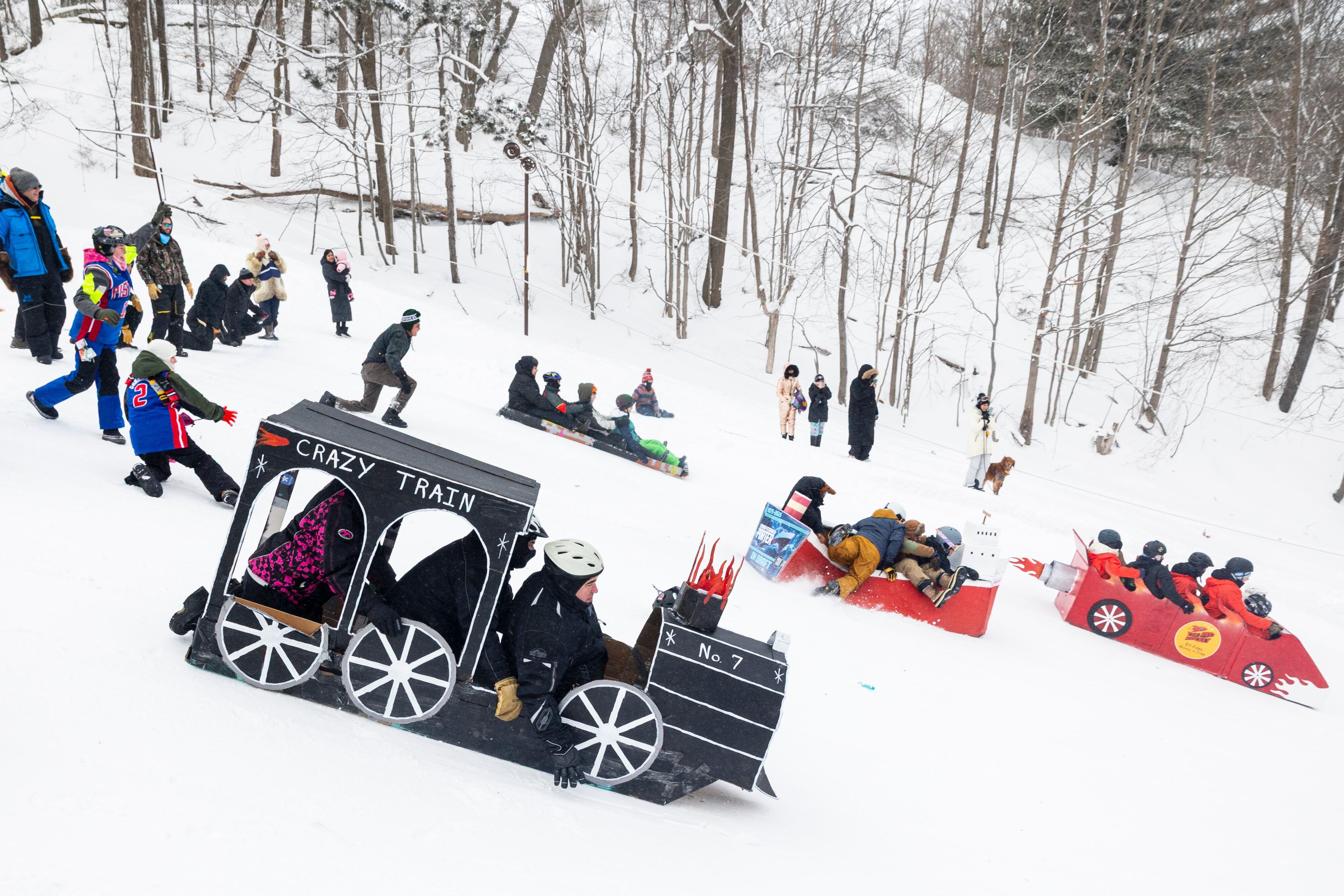 Michiganders brave 7-year temperature low for famous cardboard sled race
