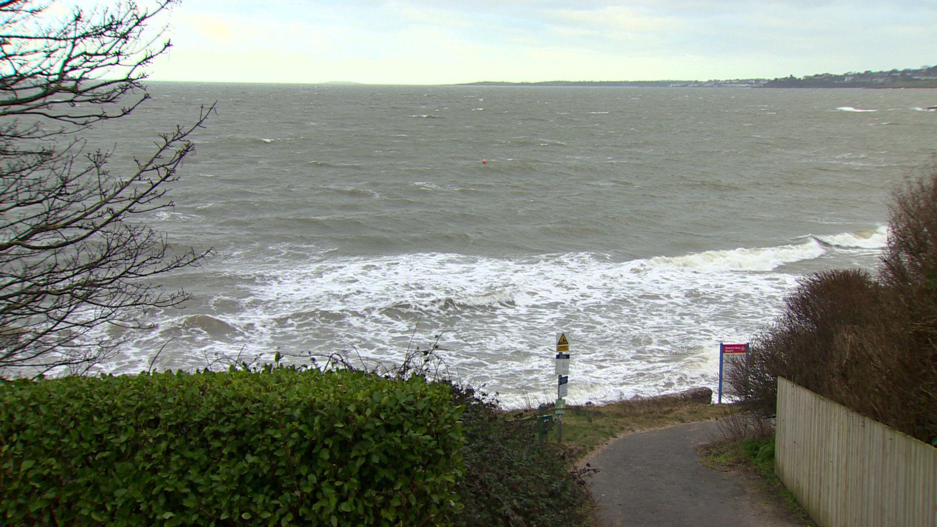 Woman dies after getting into difficulty at Helen's Bay