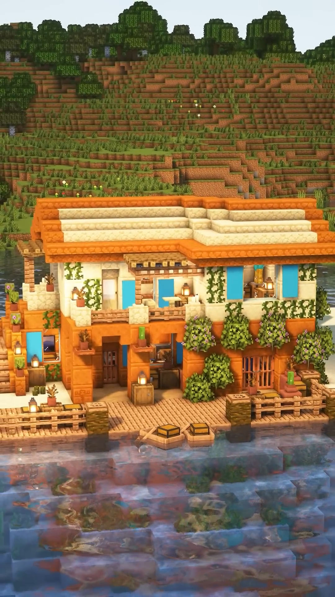 A Minecraft house perfectly placed by the shore