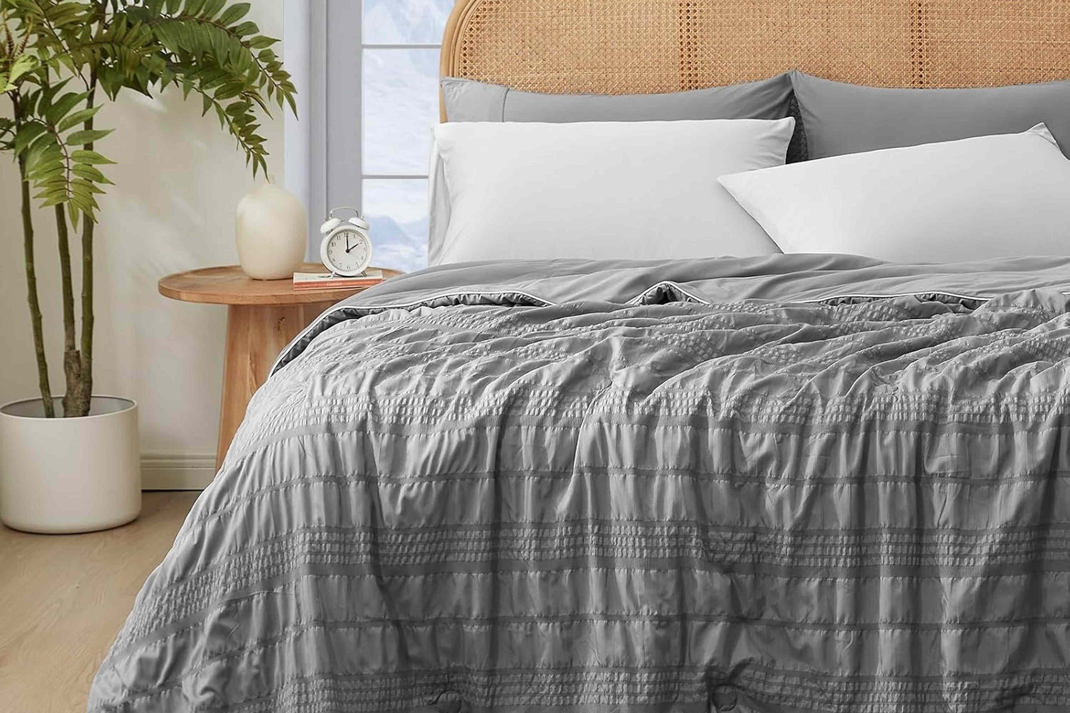 Shoppers say this quilt is like being wrapped in clouds and keeps them ...