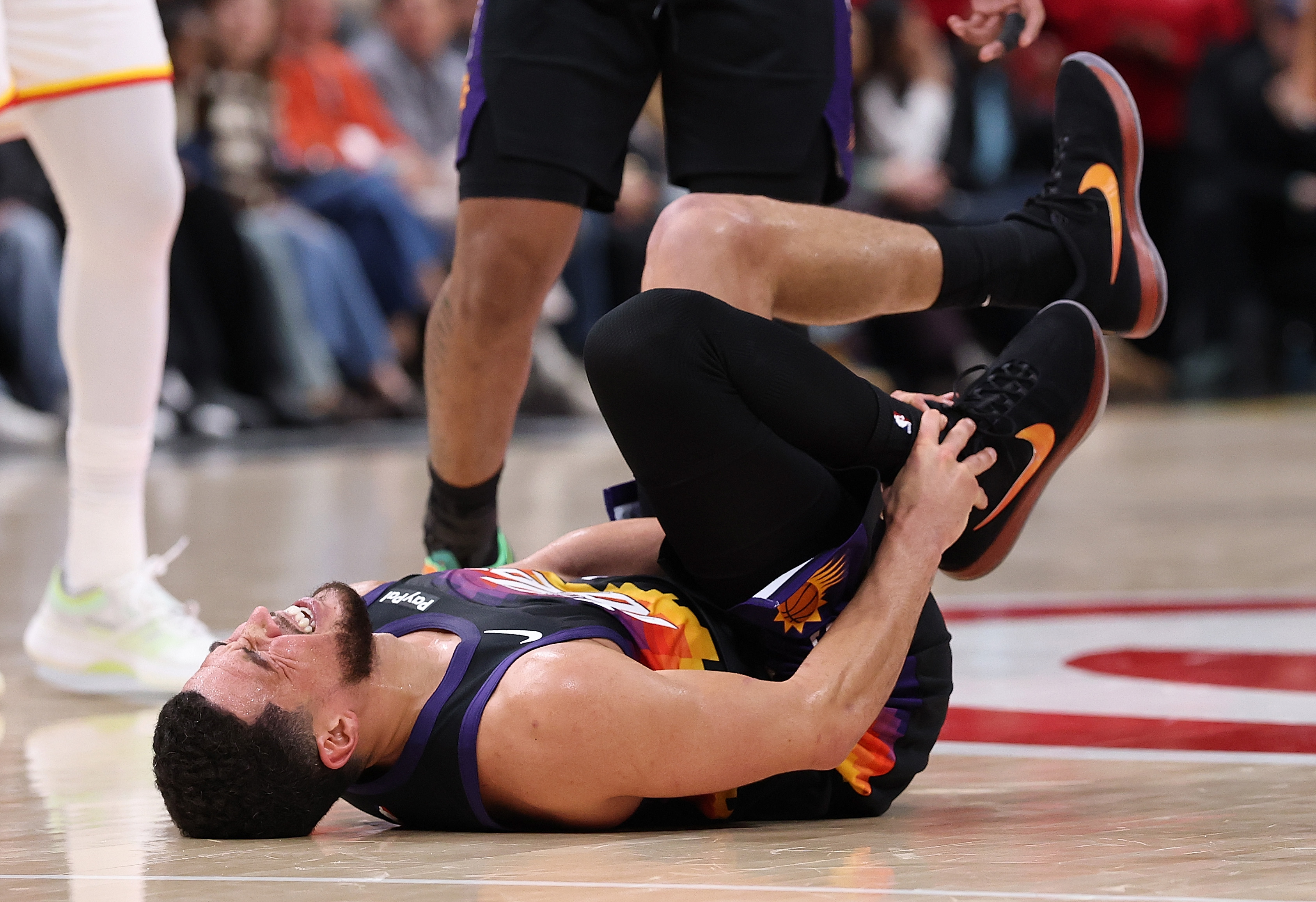 Update: Devin Booker will be re-evaluated in one week