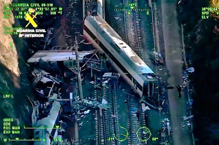 Horror as two trains hit car at level crossing as 600 passengers flee ...