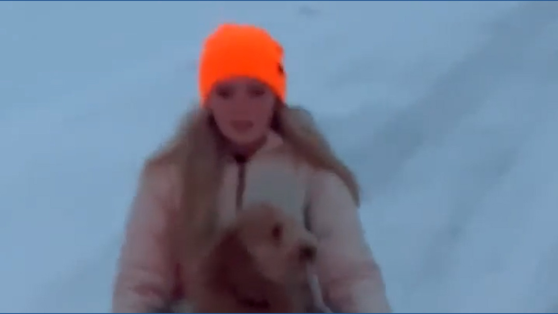 Sledding fun with the family dog