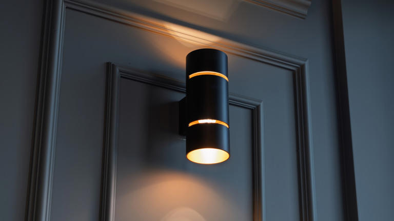 Use a Dollar Tree glass to DIY a wall sconce light that looks so high-end